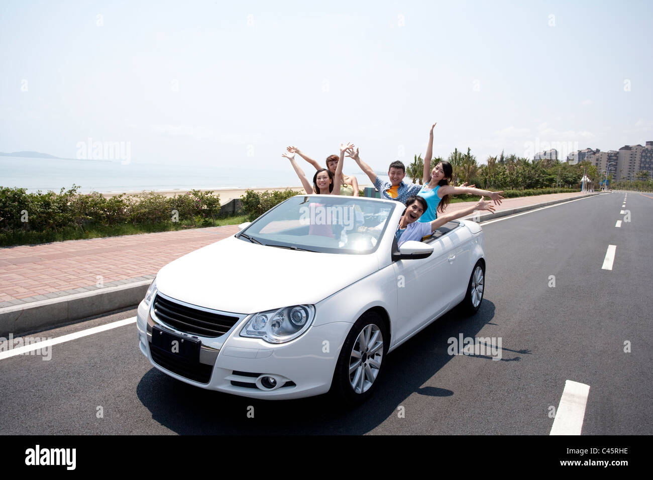 Friends Having Fun in a Convertible Stock Photo - Alamy