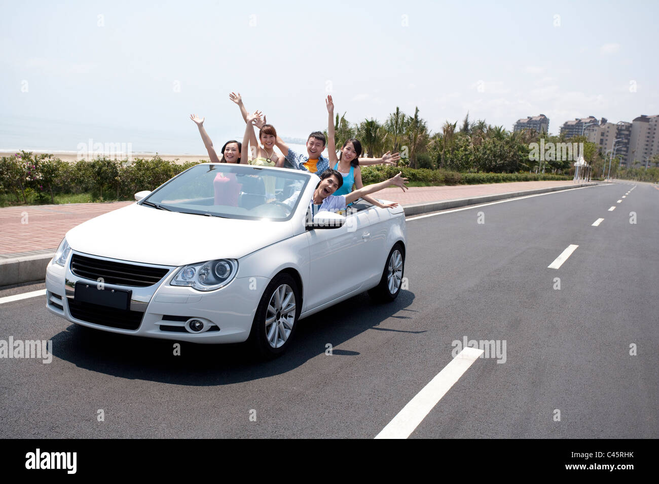 Friends Having Fun in a Convertible Stock Photo - Alamy