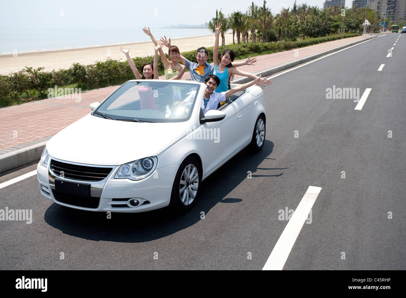 Friends Having Fun in a Convertible Stock Photo - Alamy