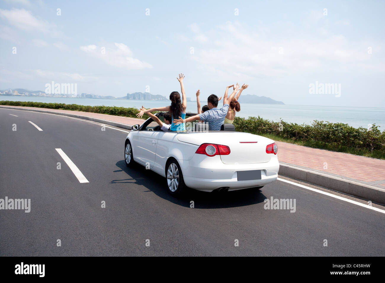 Friends Having Fun in a Convertible Stock Photo - Alamy