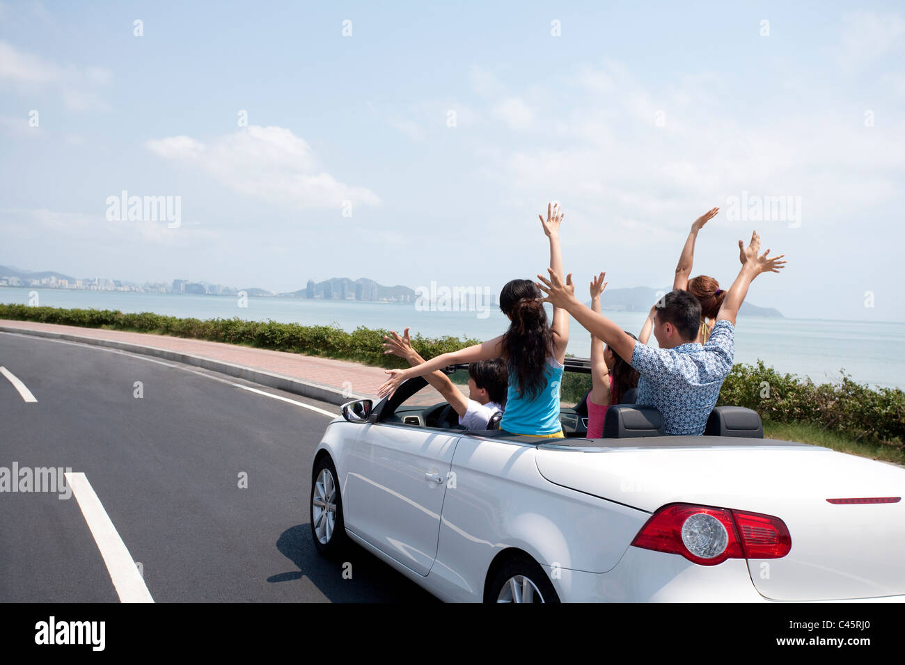 Friends Having Fun in a Convertible Stock Photo - Alamy