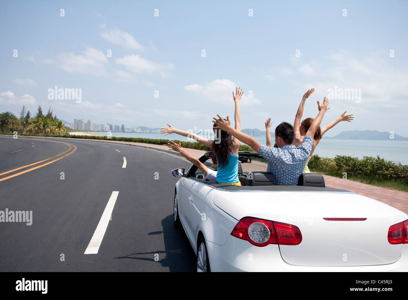 Friends Having Fun in a Convertible Stock Photo - Alamy