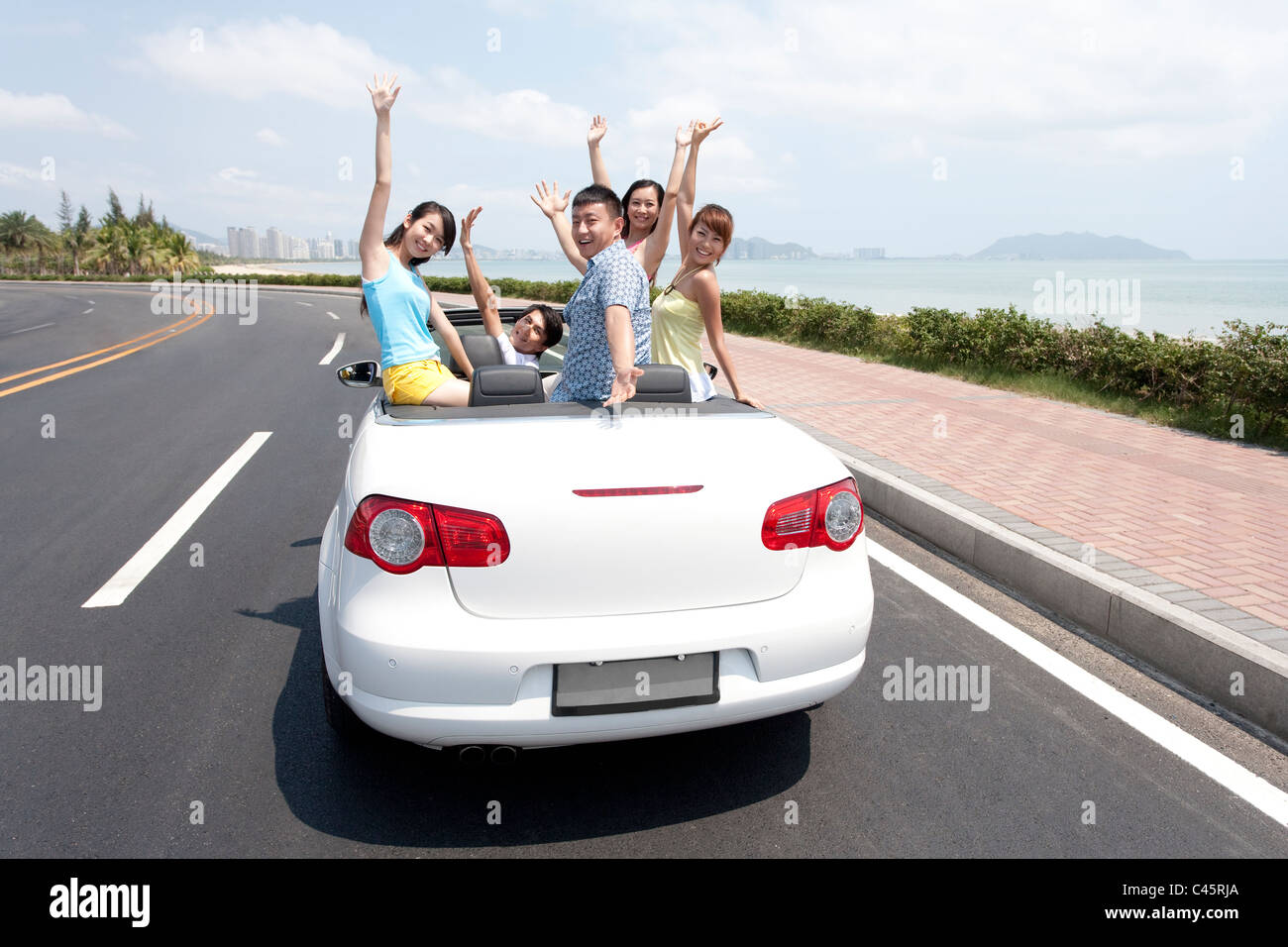 Friends Having Fun in a Convertible Stock Photo - Alamy