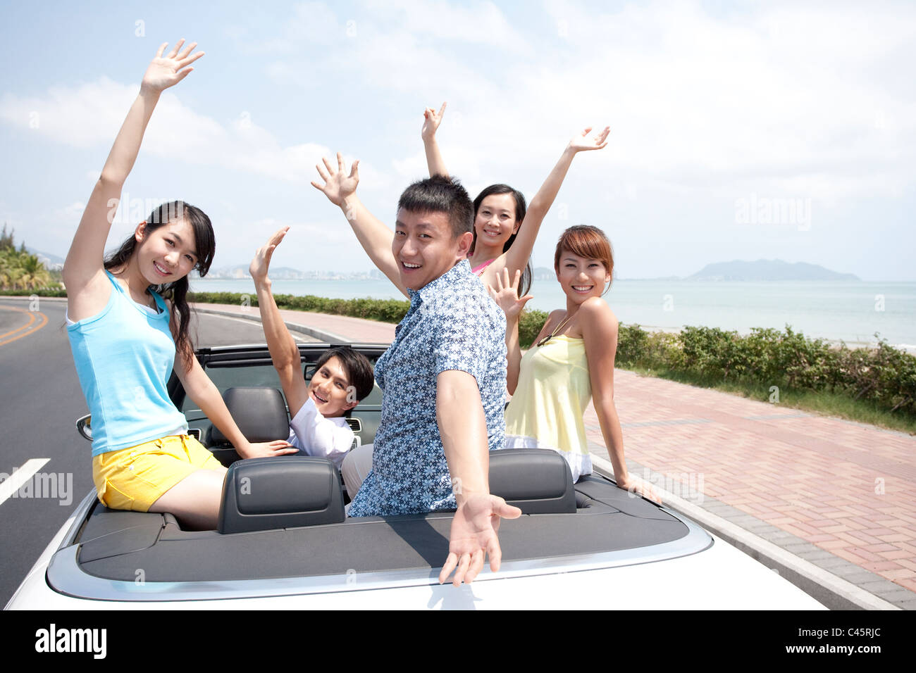 Friends Having Fun in a Convertible Stock Photo - Alamy