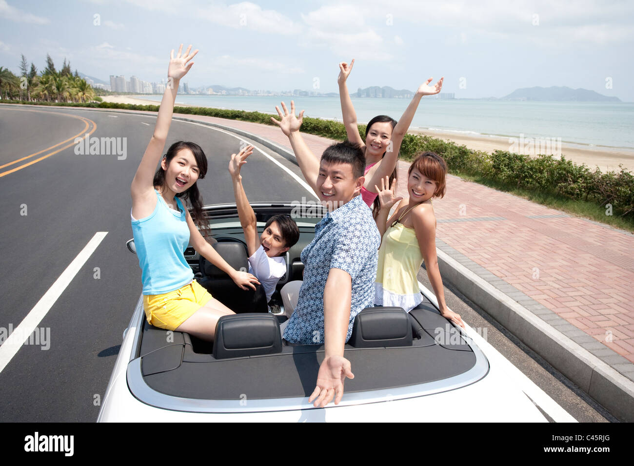 Friends Having Fun in a Convertible Stock Photo - Alamy