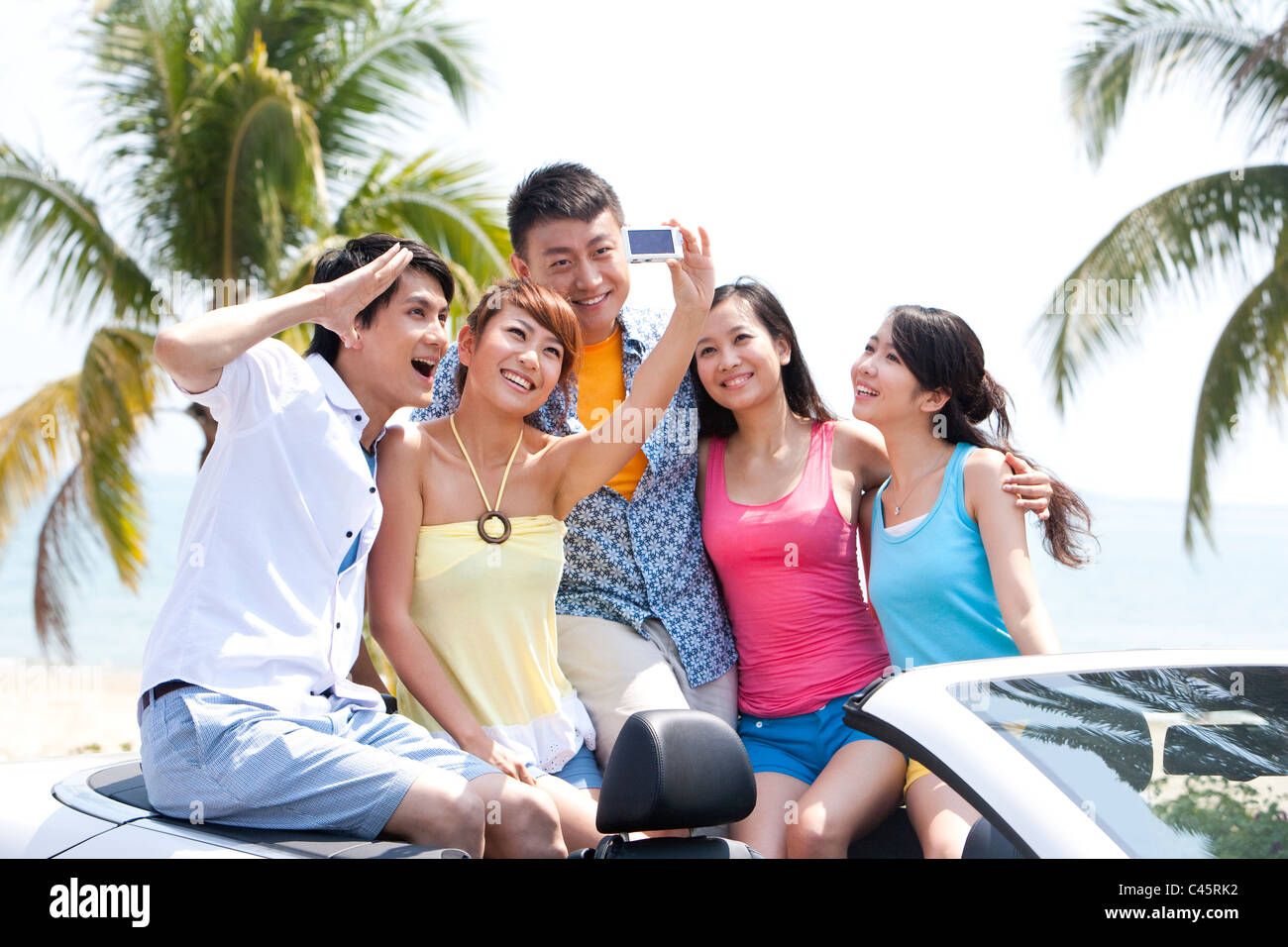 Friends Having Fun in a Convertible Stock Photo - Alamy
