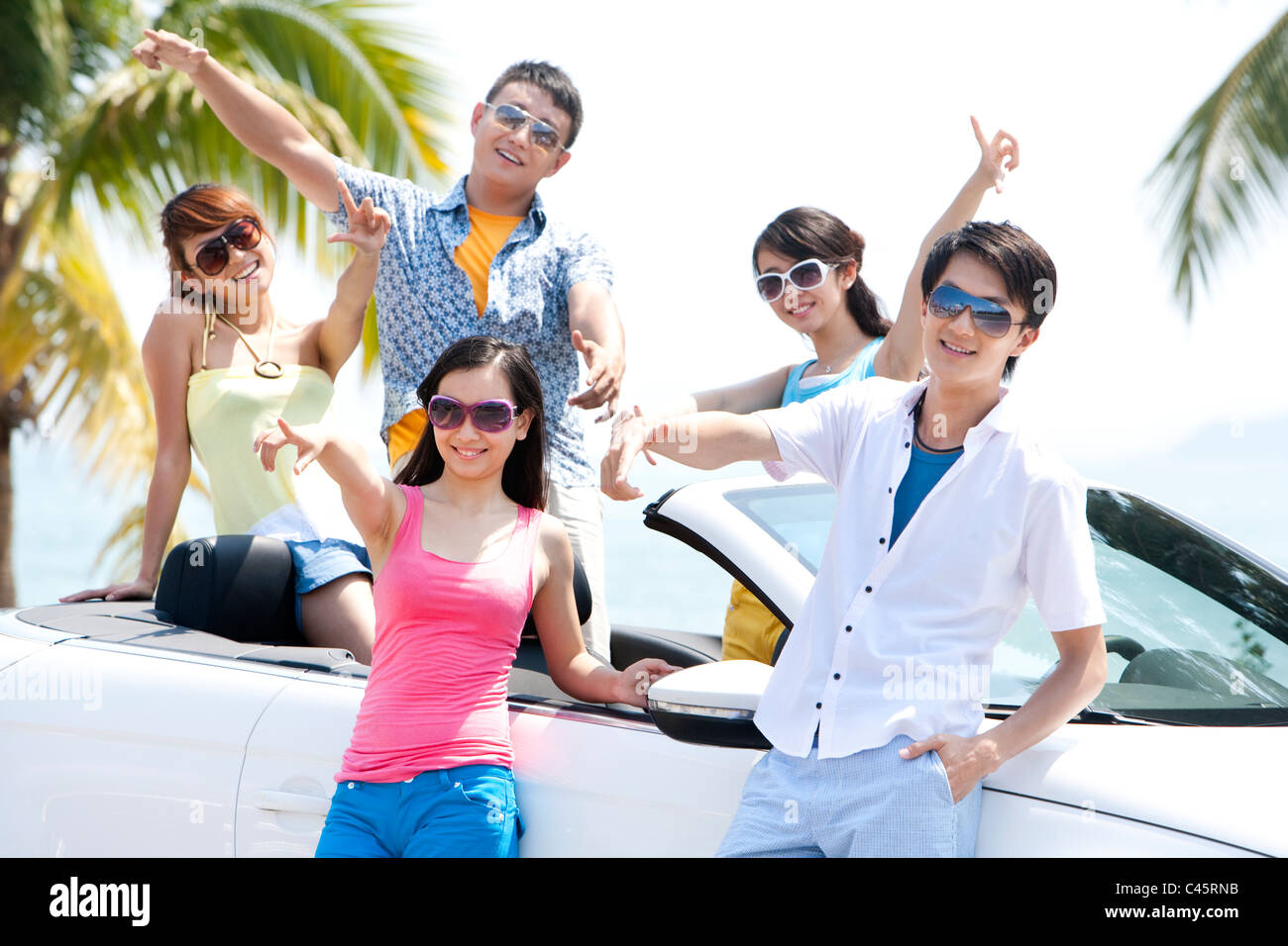 Friends Having Fun in a Convertible Stock Photo - Alamy