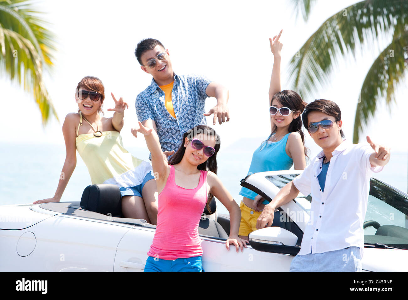 Friends Having Fun in a Convertible Stock Photo - Alamy