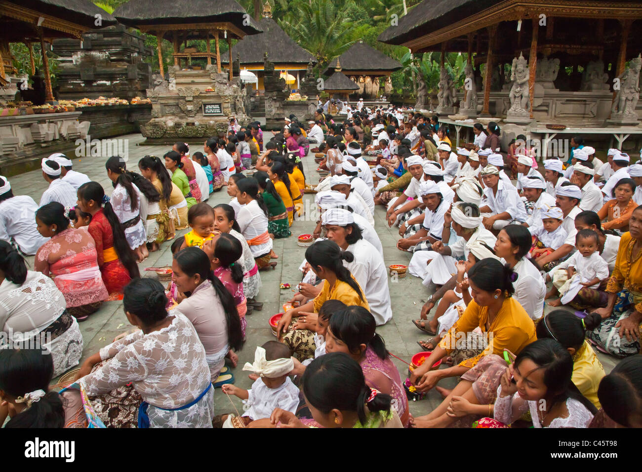 A Hindu crowd worships at the PURA TIRTA EMPUL TEMPLE COMPLEX during ...
