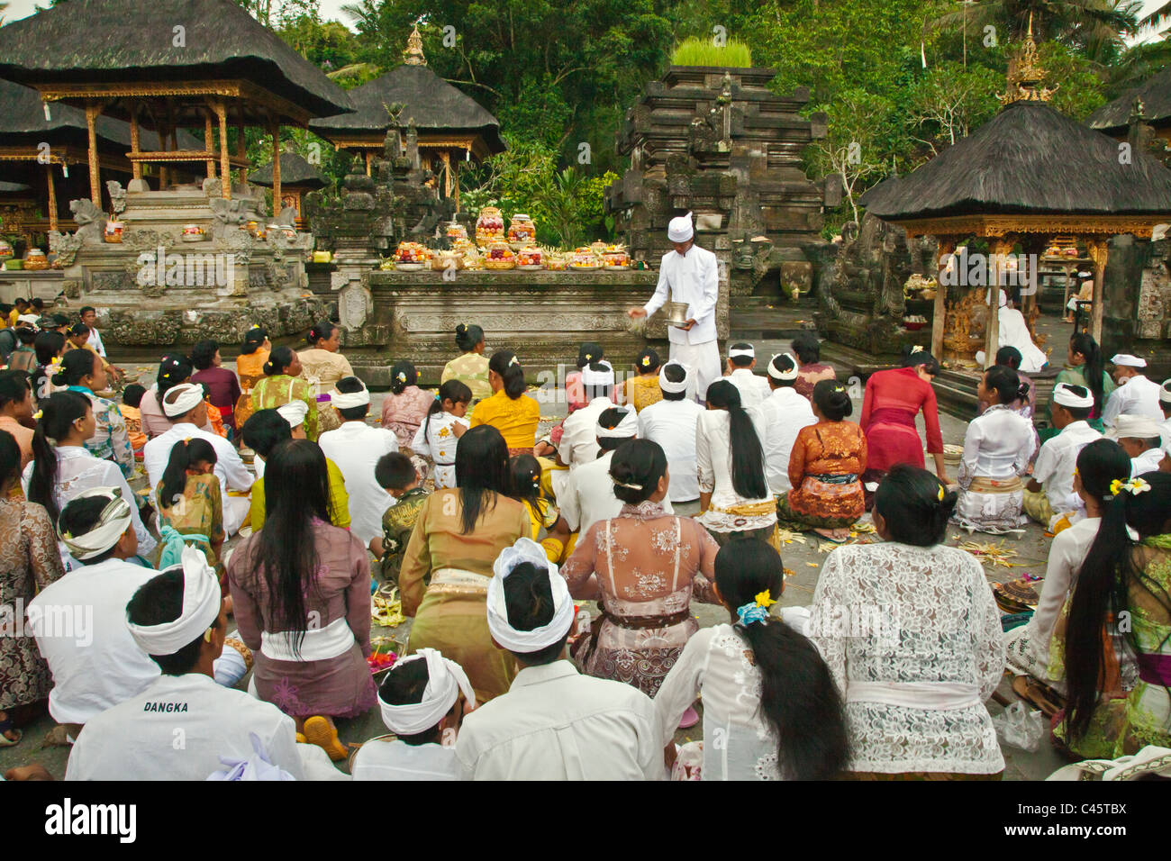 A Hindu crowd worships at the PURA TIRTA EMPUL TEMPLE COMPLEX during ...