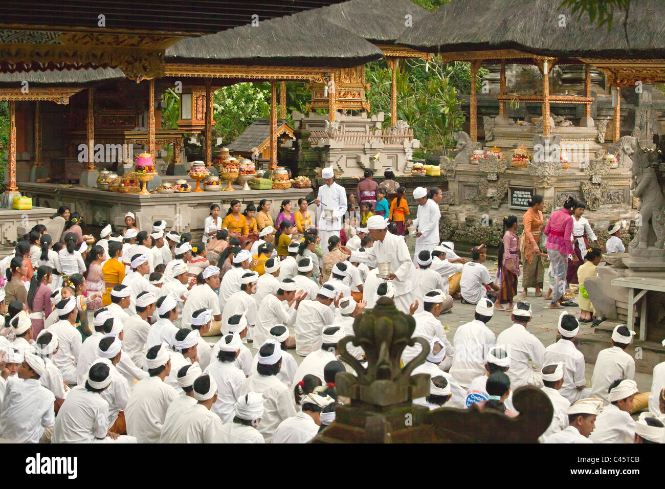 A Hindu crowd worships at the PURA TIRTA EMPUL TEMPLE COMPLEX during ...