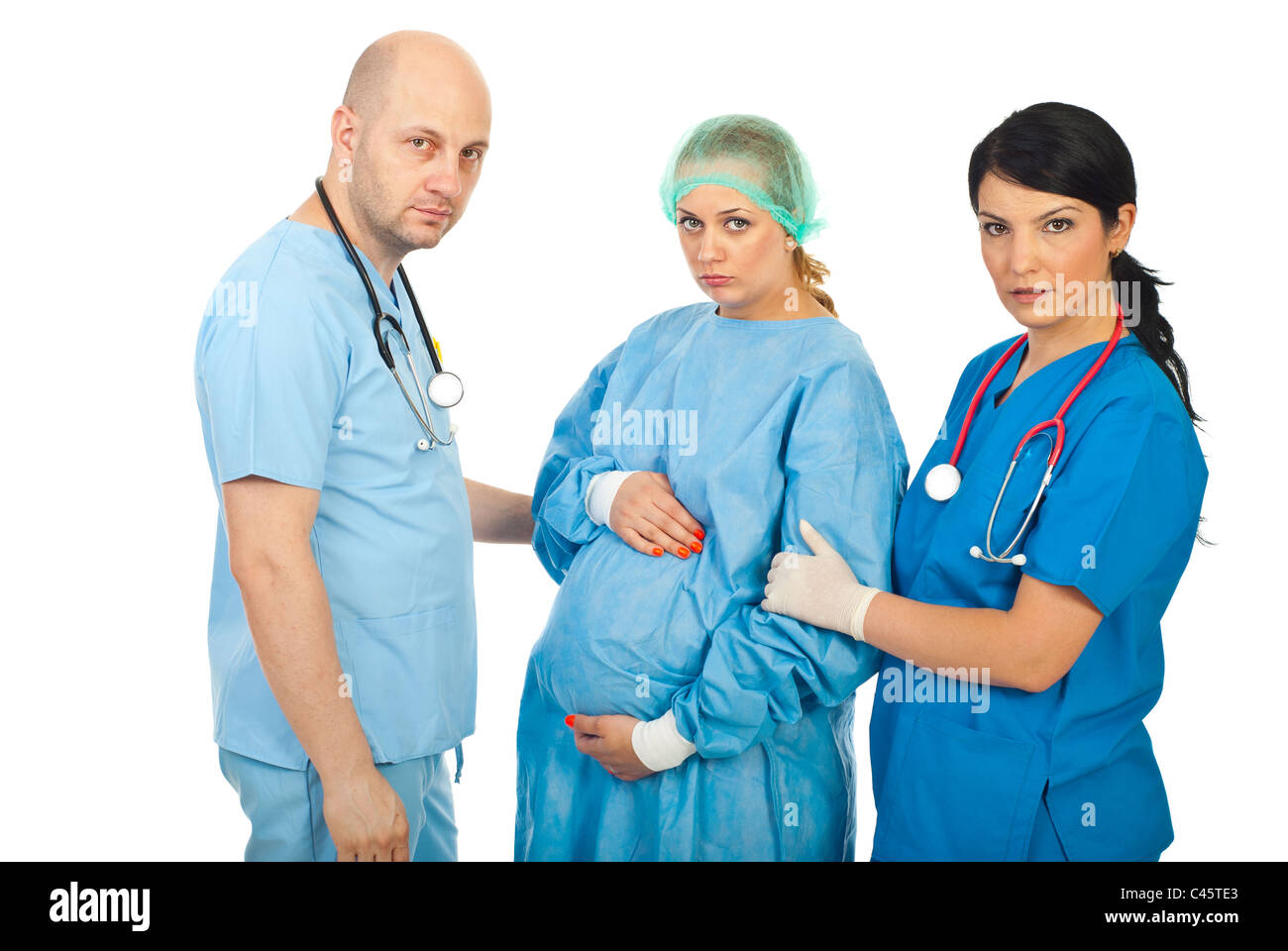 Doctors with pregnant woman prepared for birth isolated on white ...