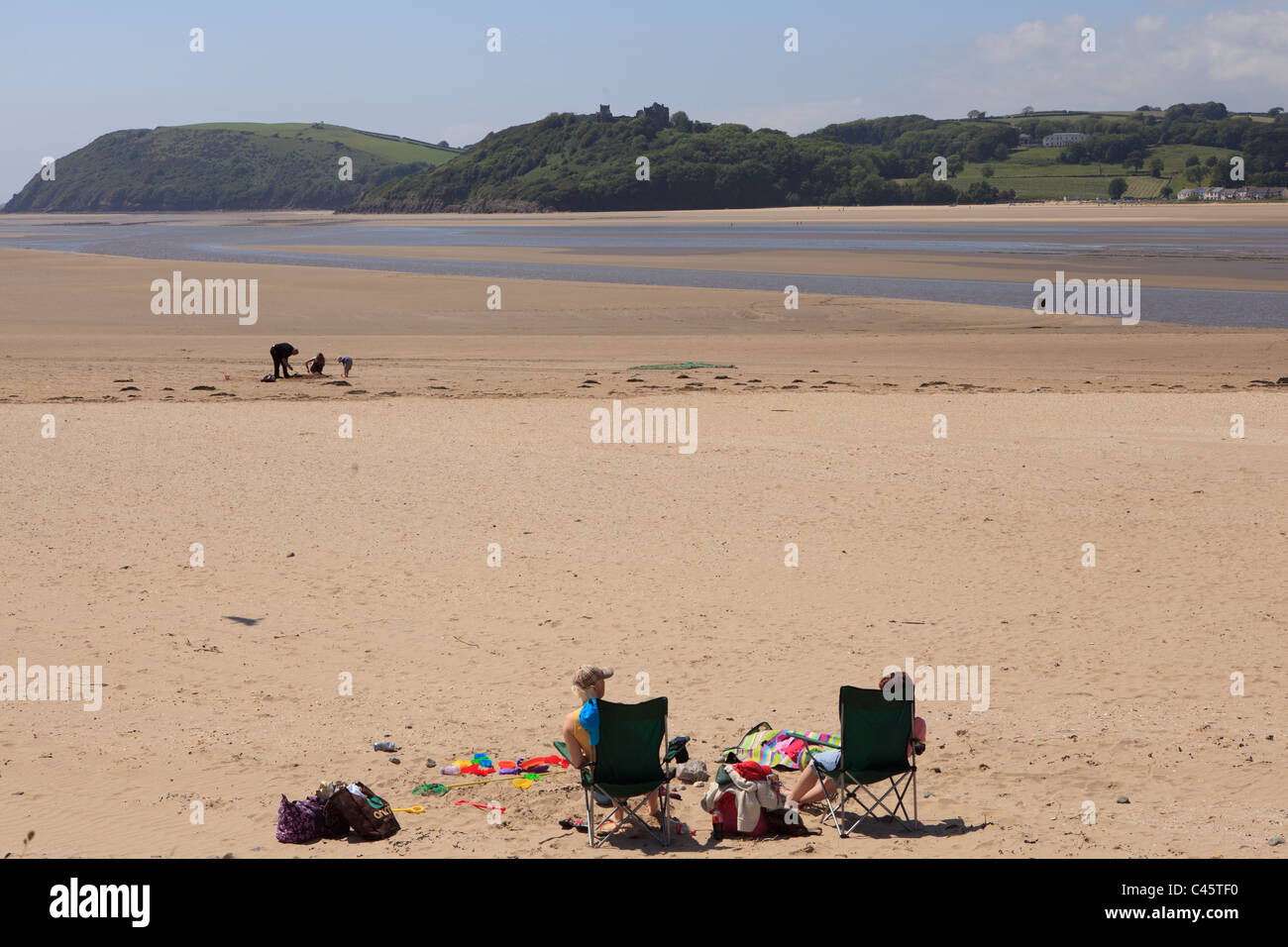 Family on the beach at Ferryside, near Llanelli, Carmarthenshire, South ...