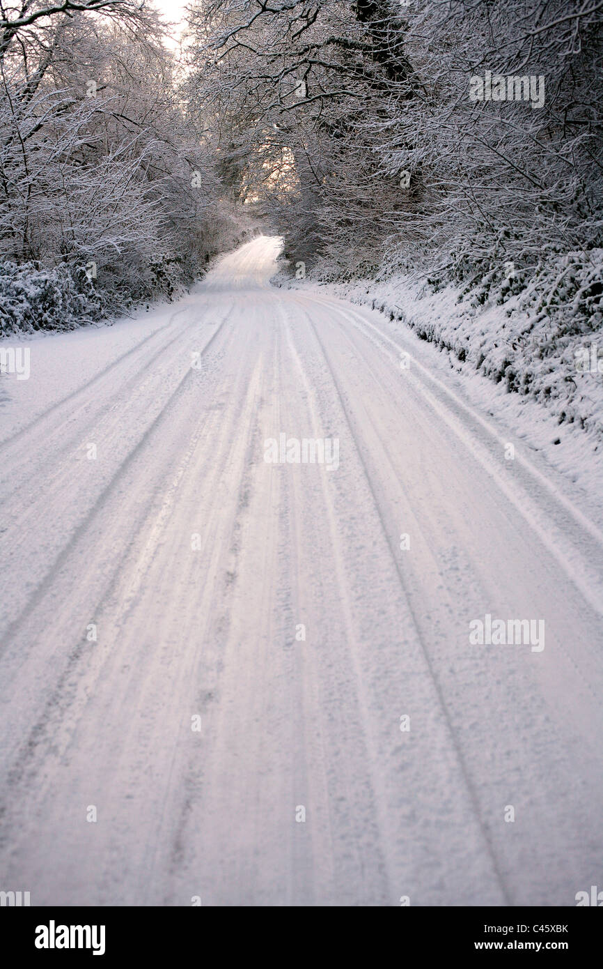 A snowy country road Stock Photo - Alamy