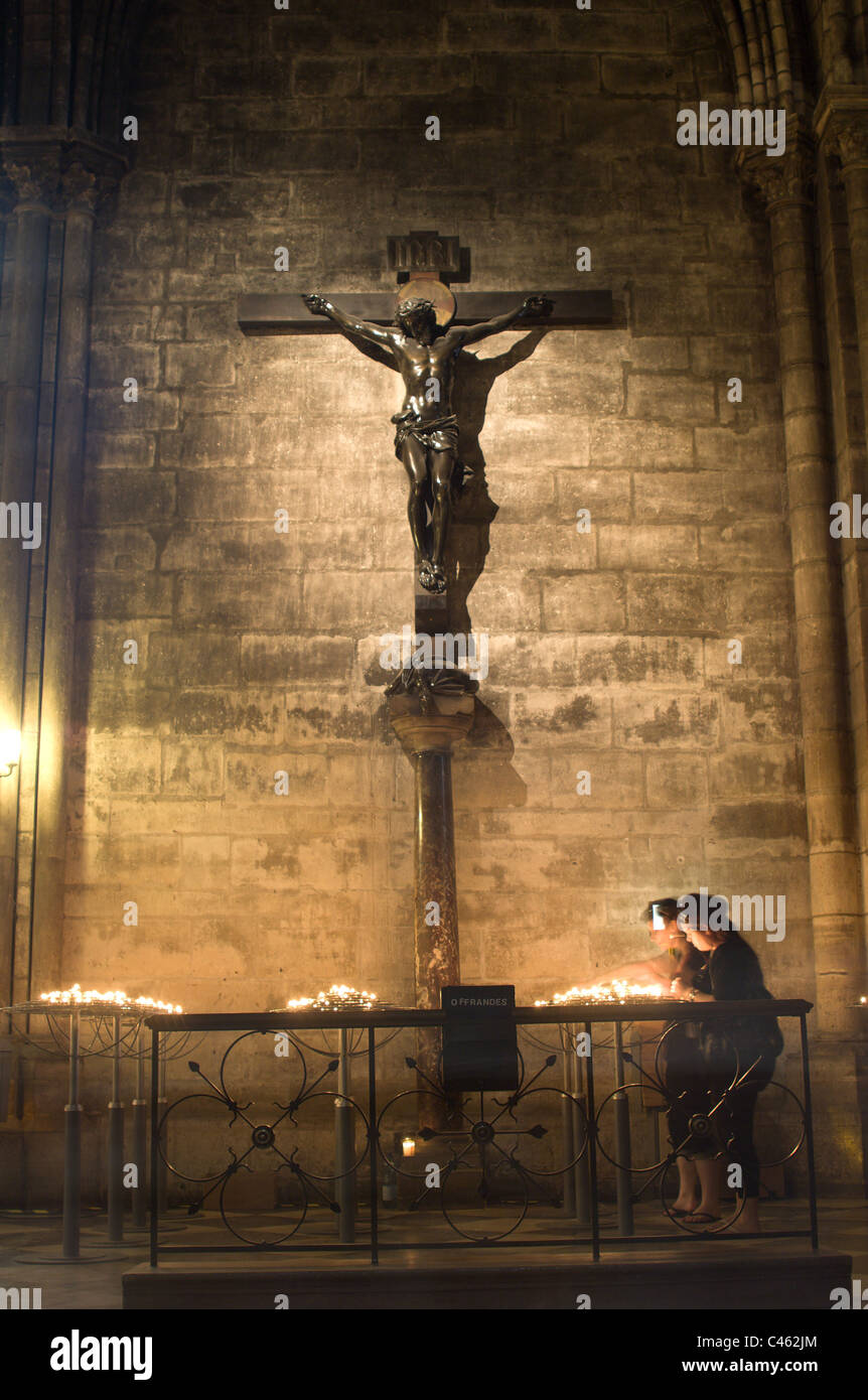 Paris - prayer under cross in the gothic church Stock Photo - Alamy