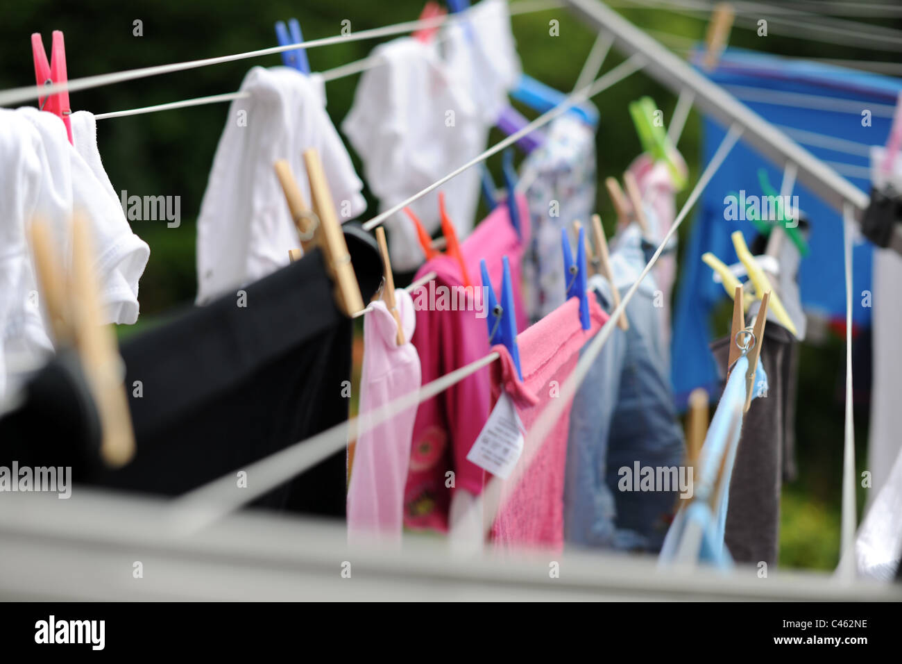 Washing pegged up to dry on washing lines Stock Photo - Alamy