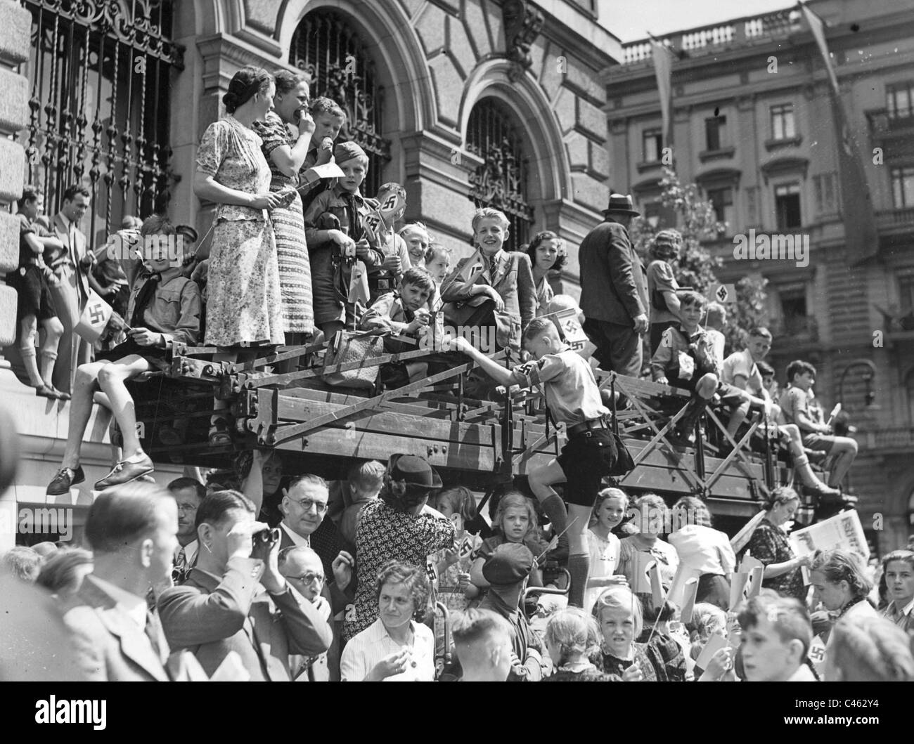 Spectators wait for Hitler to drive passed Stock Photo - Alamy