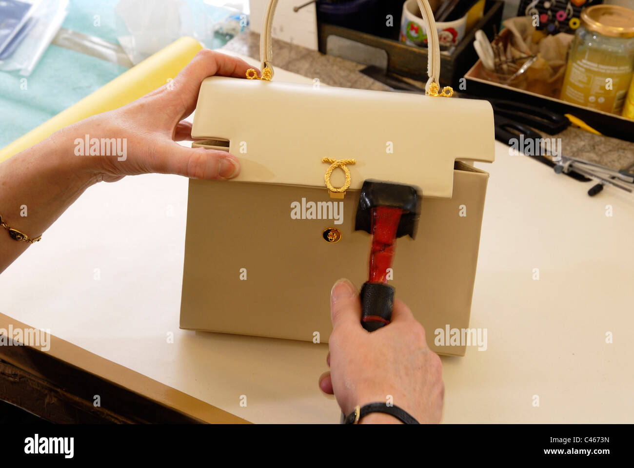 Sue Green crimping a bag at Launer, the royal handbag maker, in Walsall ...