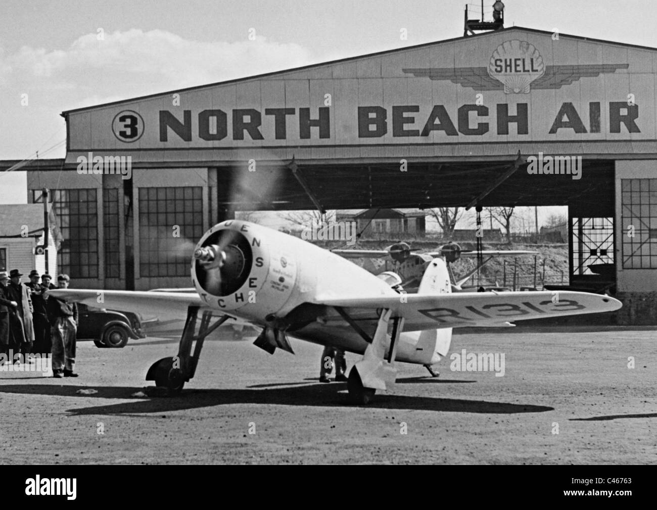 Plane in front of a hangar on the North Beach Airport, 1937 Stock Photo ...