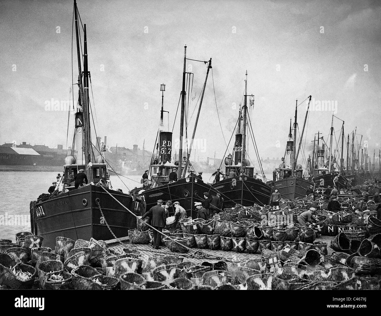Fishing fleet in the harbor, 1928 Stock Photo - Alamy
