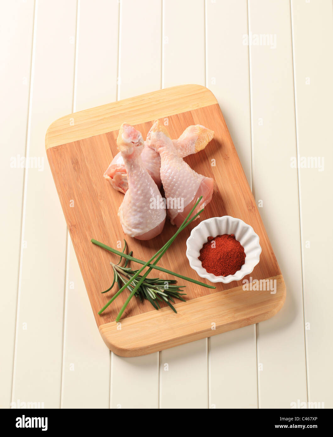 Raw chicken drumsticks with pepper hi-res stock photography and images ...