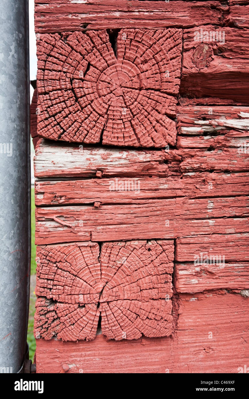 red painted log house wall Stock Photo - Alamy