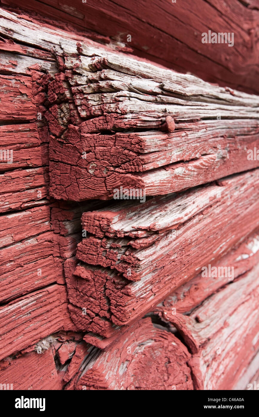 red painted log house wall Stock Photo - Alamy