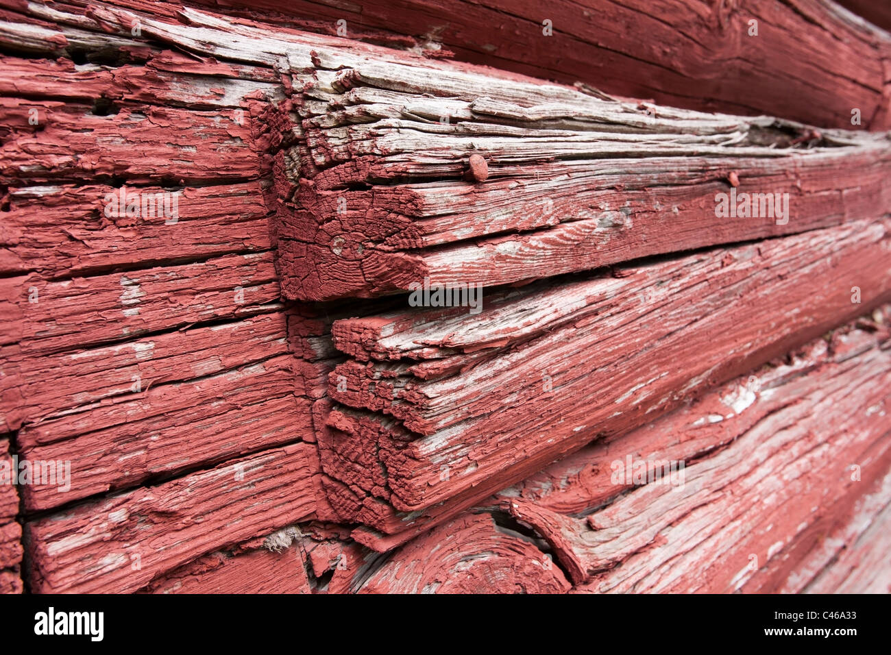 red painted log house wall Stock Photo - Alamy
