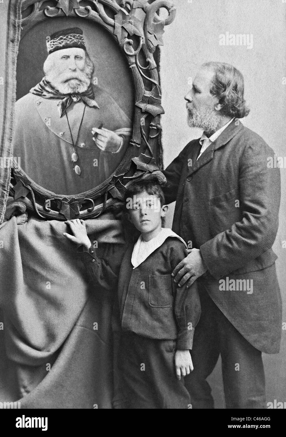 The son and grandson with a painting of Giuseppe Garibaldi Stock Photo ...