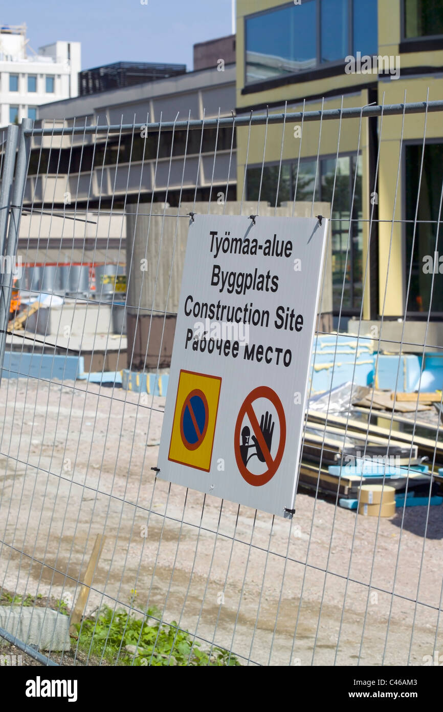 construction site sign with four languages, Finland Stock Photo - Alamy
