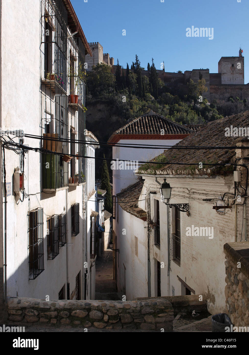 A side street in the old residential area overlooking the Alhambra in ...
