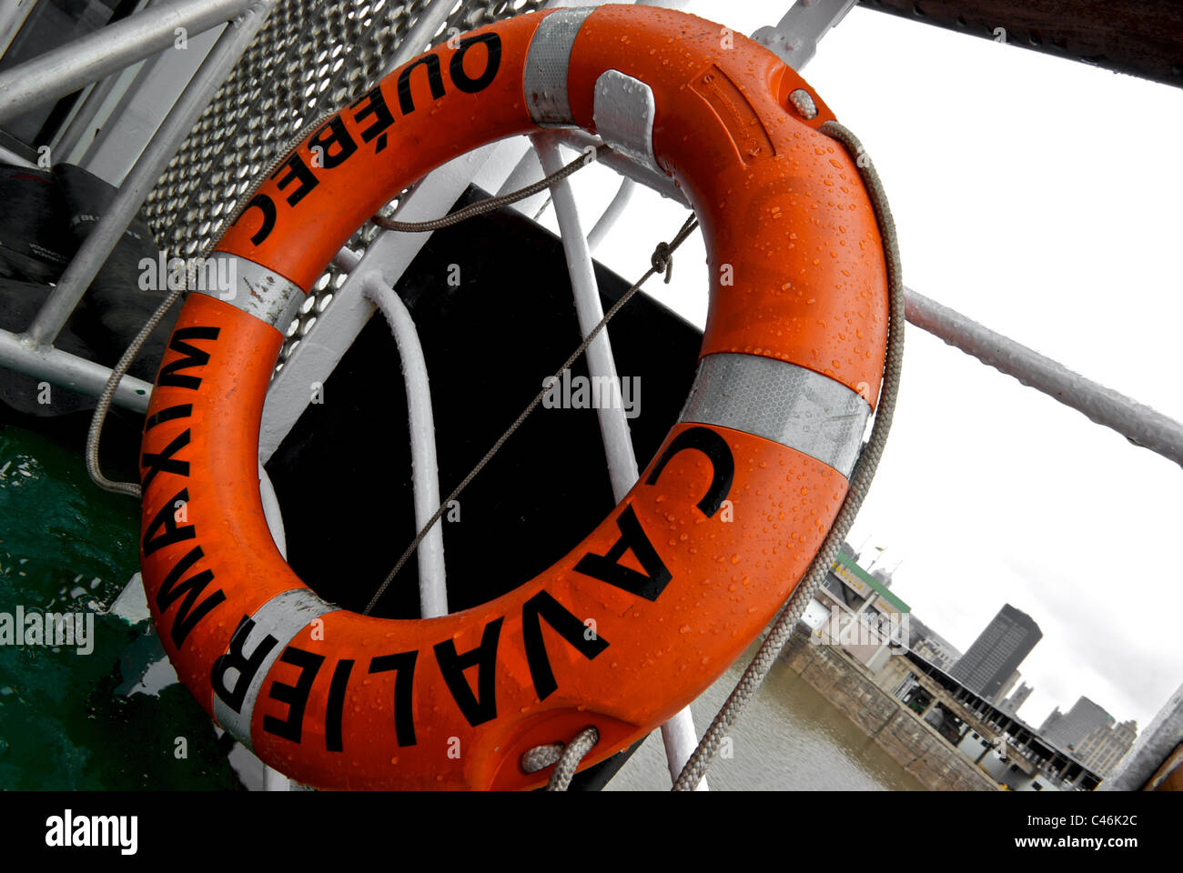 Life ring from river cruise ship Cavalier Maxim in rain old Montreal ...