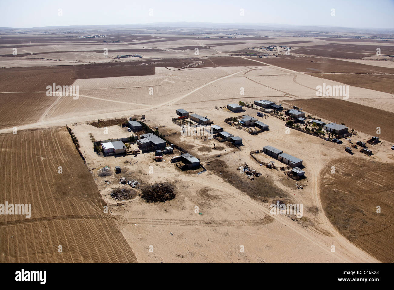 Aerial photograph of a Bedouin compound in the northern Negev desert ...