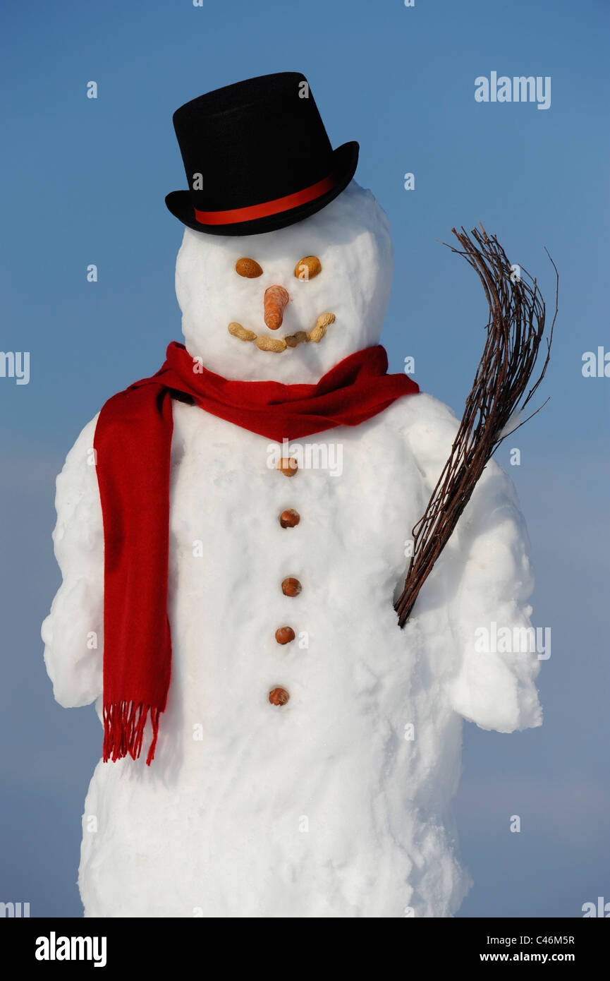 Snowman at Christmas with hat and shawl Stock Photo - Alamy