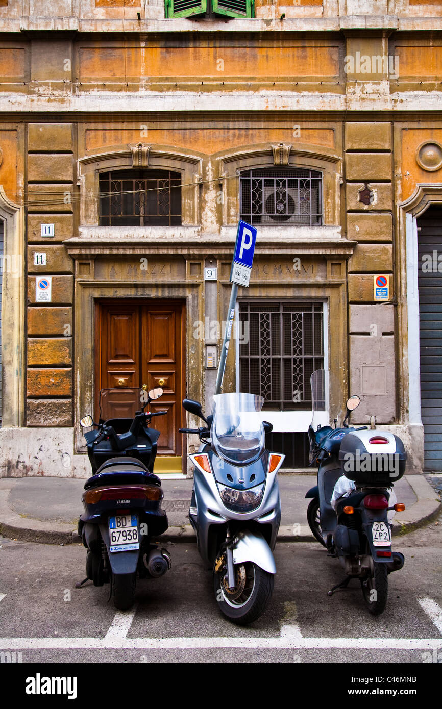 Scooters parked on a street in Rome Stock Photo - Alamy