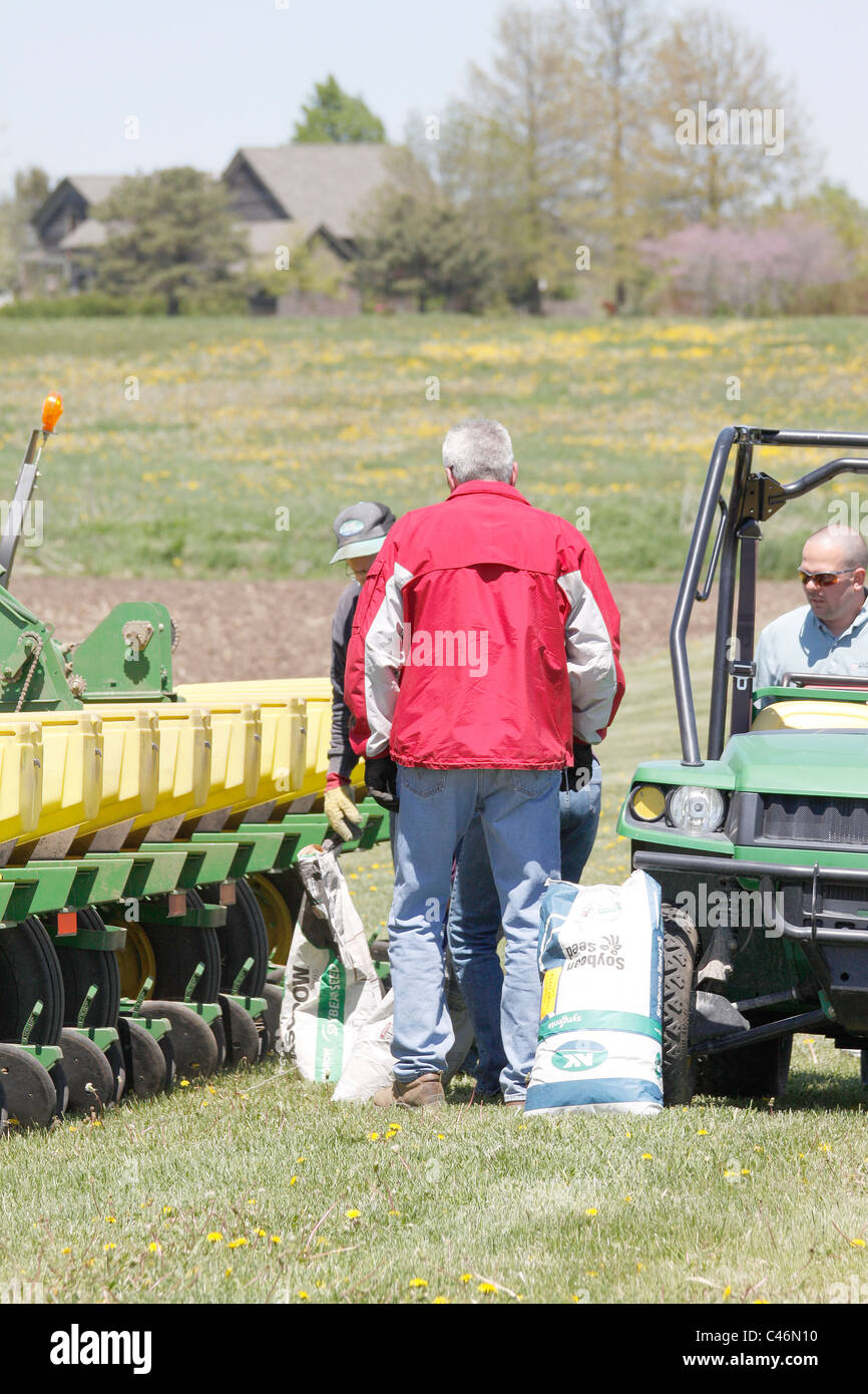 Workers prepare for sowing a seed demonstration plot Stock Photo - Alamy