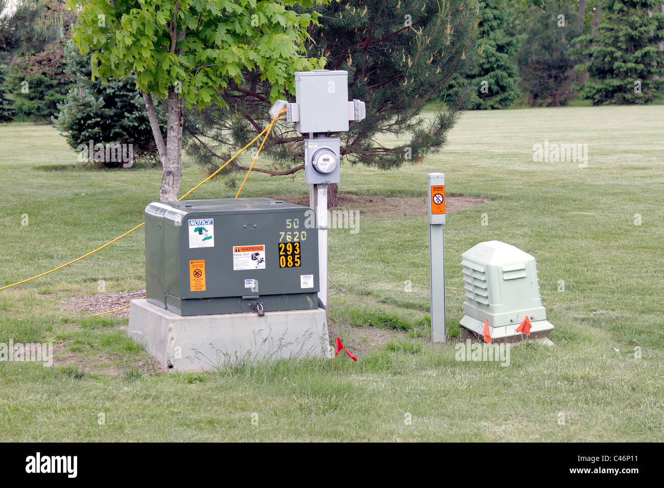 Electric utility transformer and temporary meter at construction site ...