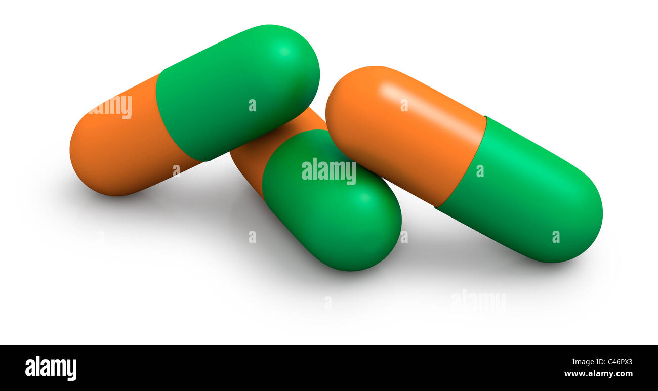 Three green and orange capsules on a white background Stock Photo - Alamy
