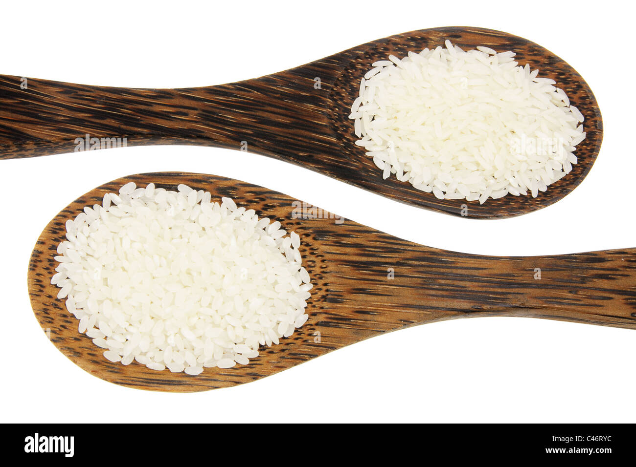 Wooden Spoons with Rice Stock Photo - Alamy