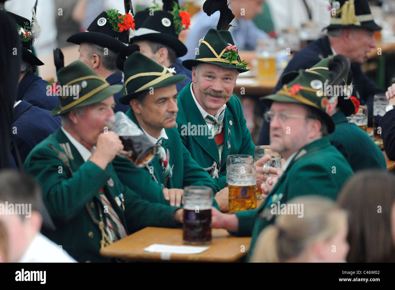 bavarian performers in traditional clothes of ancient soldiers at folk ...