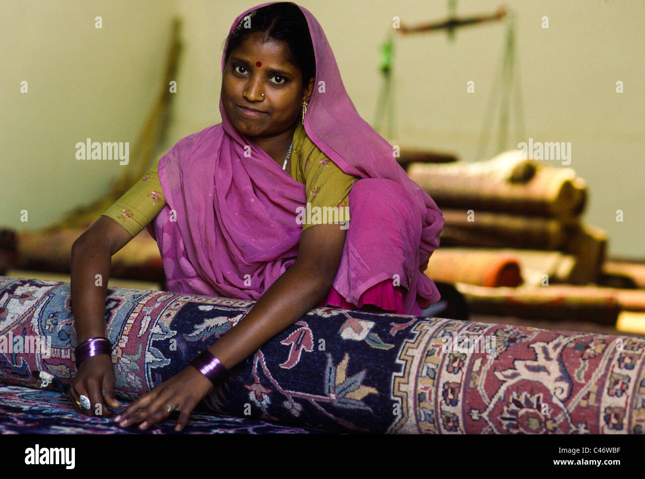 Woman with rug in rug factory in Jaipur, Rajasthan, India Stock Photo ...