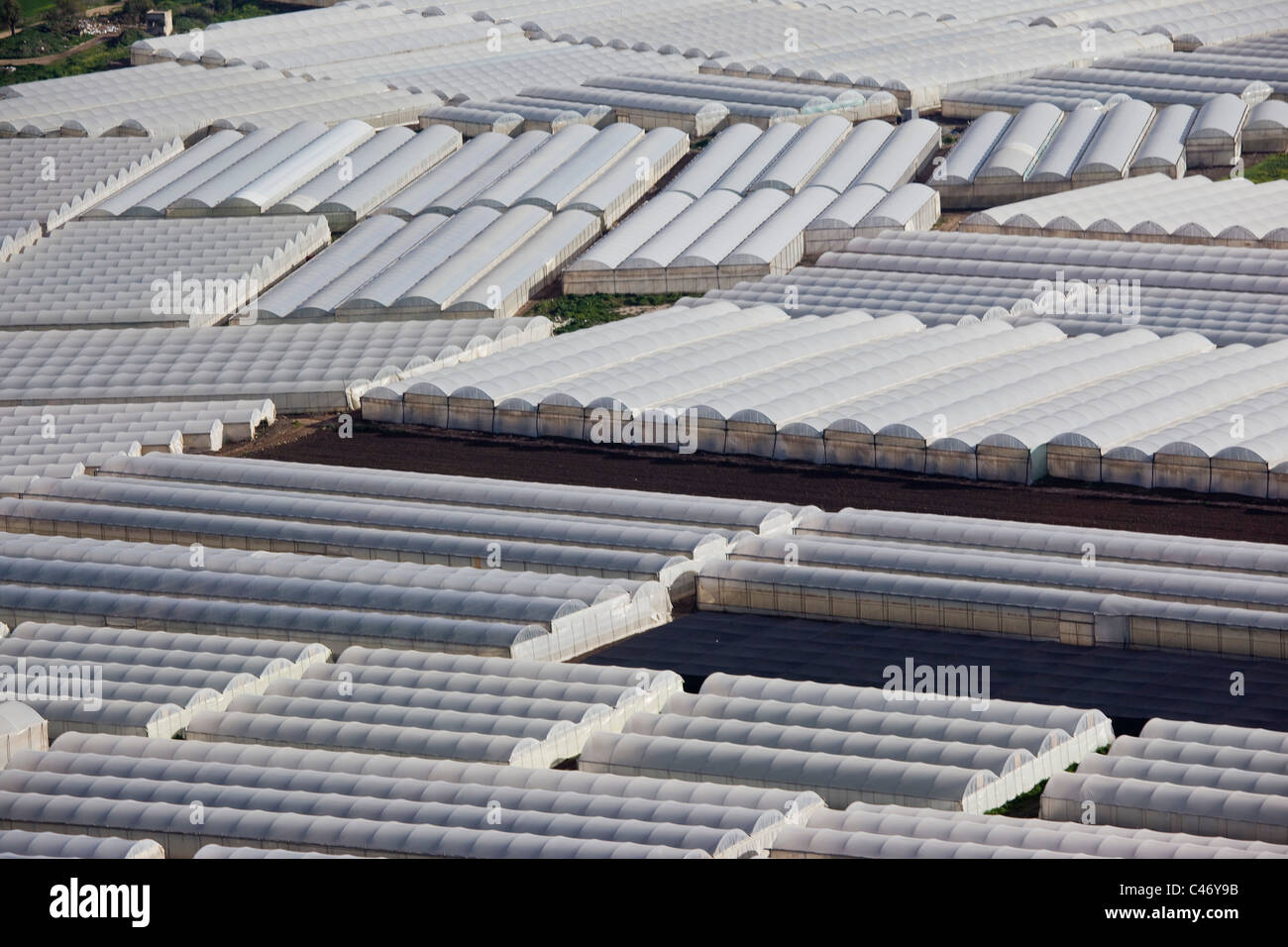 Abstract view of greenhouses in the Sharon Stock Photo - Alamy