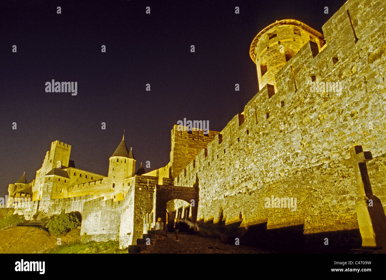 Carcassone Castle at night from below outer wall of the medieval city ...