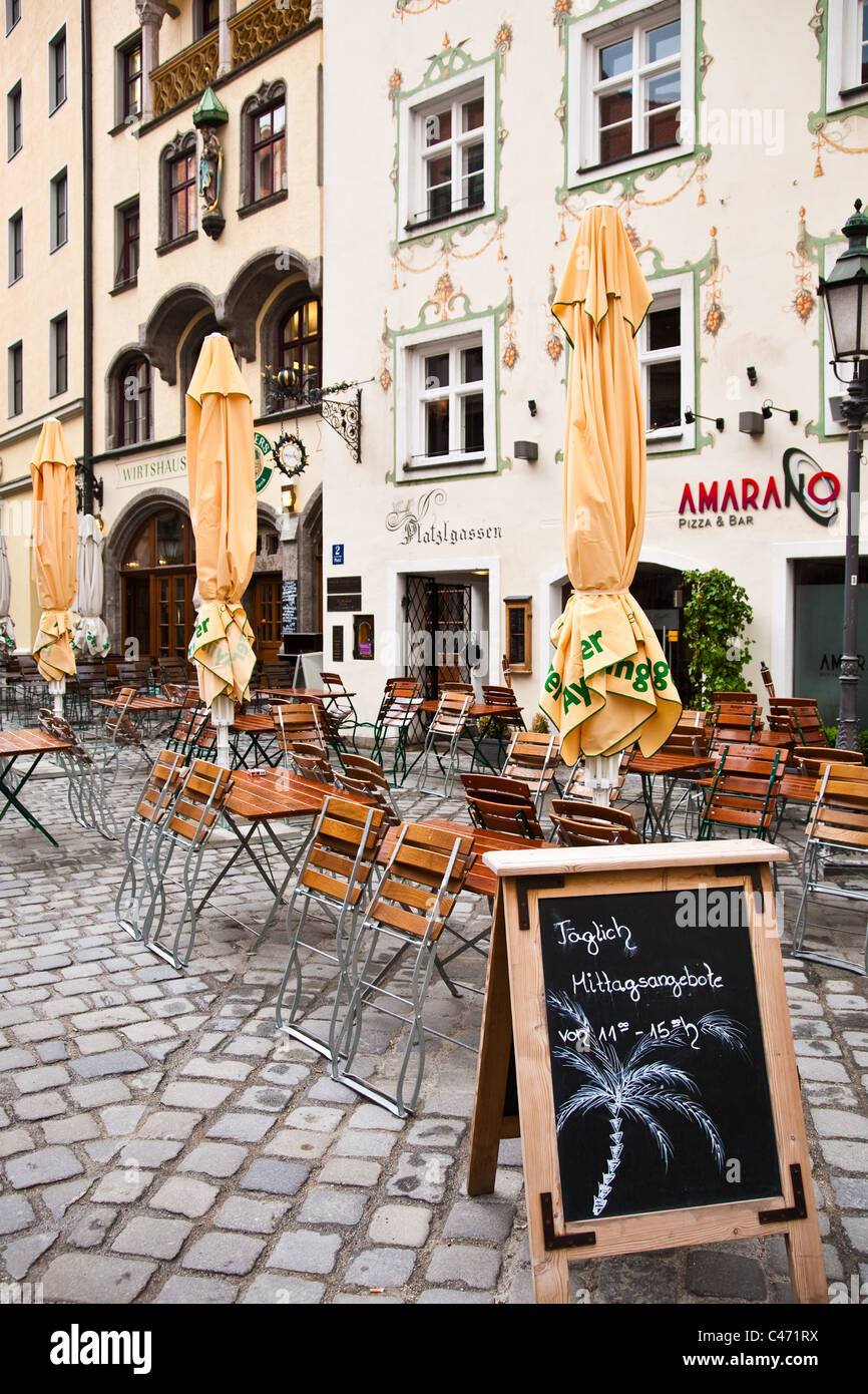Deserted outdoor dining area on a cool spring day in Munich, Germany ...
