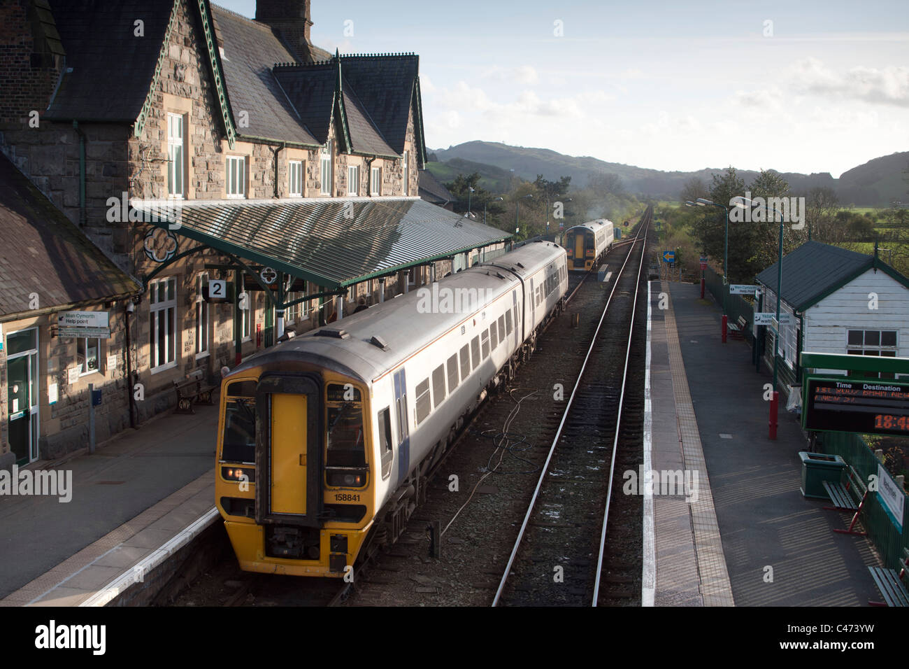 two passenger trains at machynlleth station north wales Stock Photo - Alamy