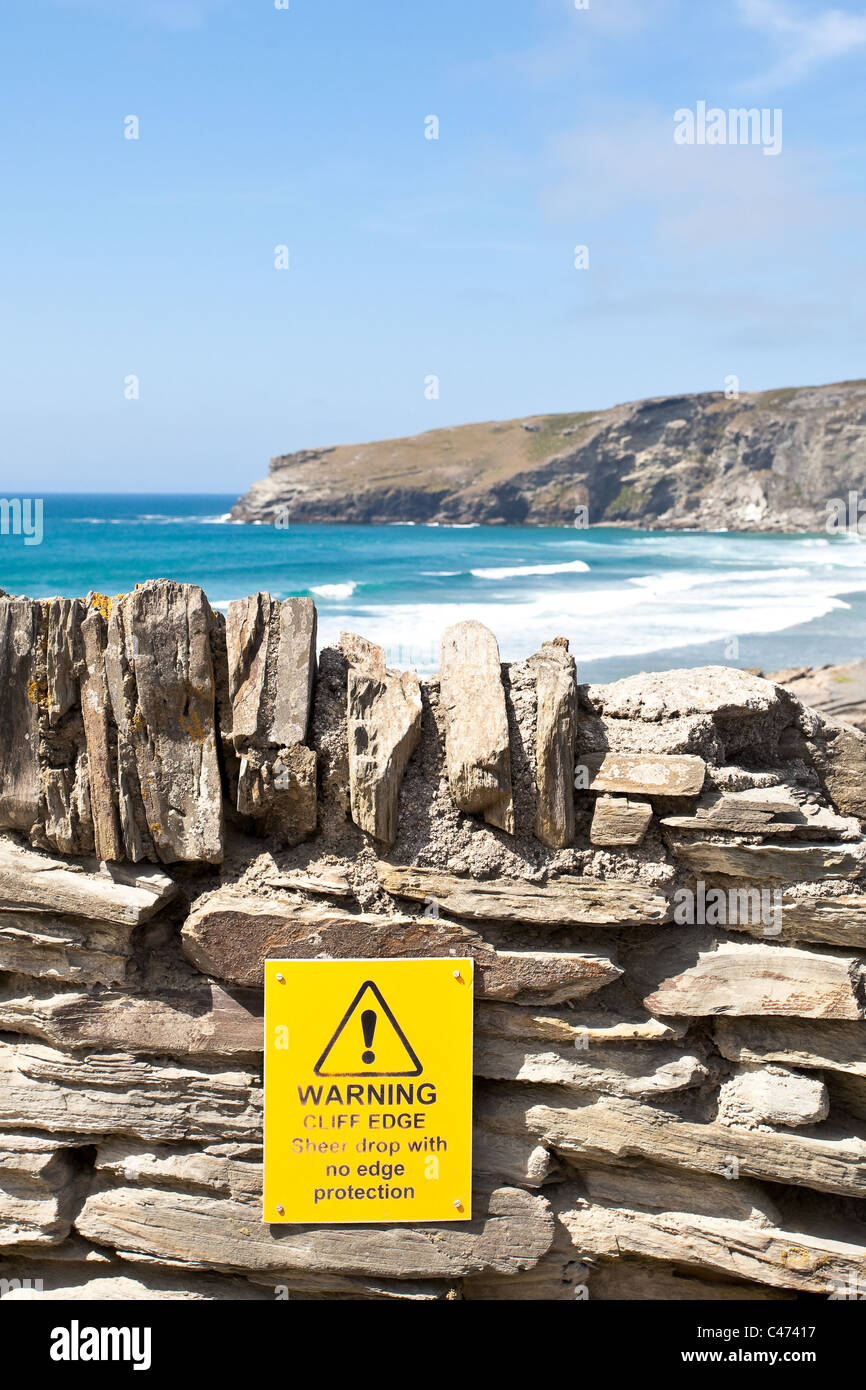 Warning sign at a cliff edge in Cornwall, UK Stock Photo - Alamy