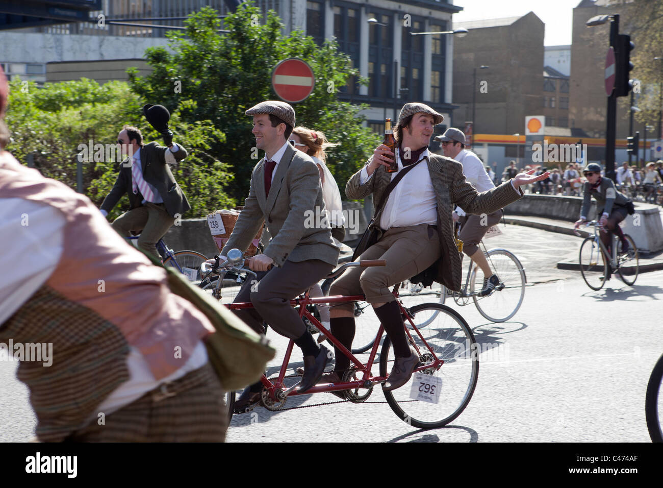 The Tweed Run, London, UK, 11th April 2011: participants ride past Old ...