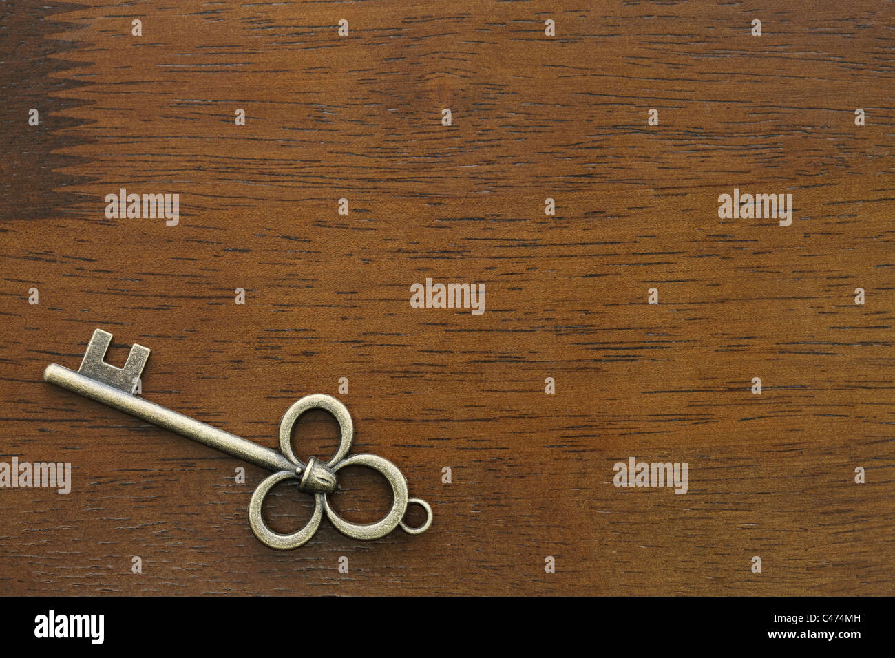 Old key on a wooden table Stock Photo - Alamy
