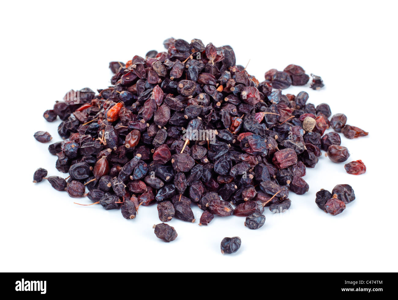 black dry barberry isolated on white background Stock Photo - Alamy