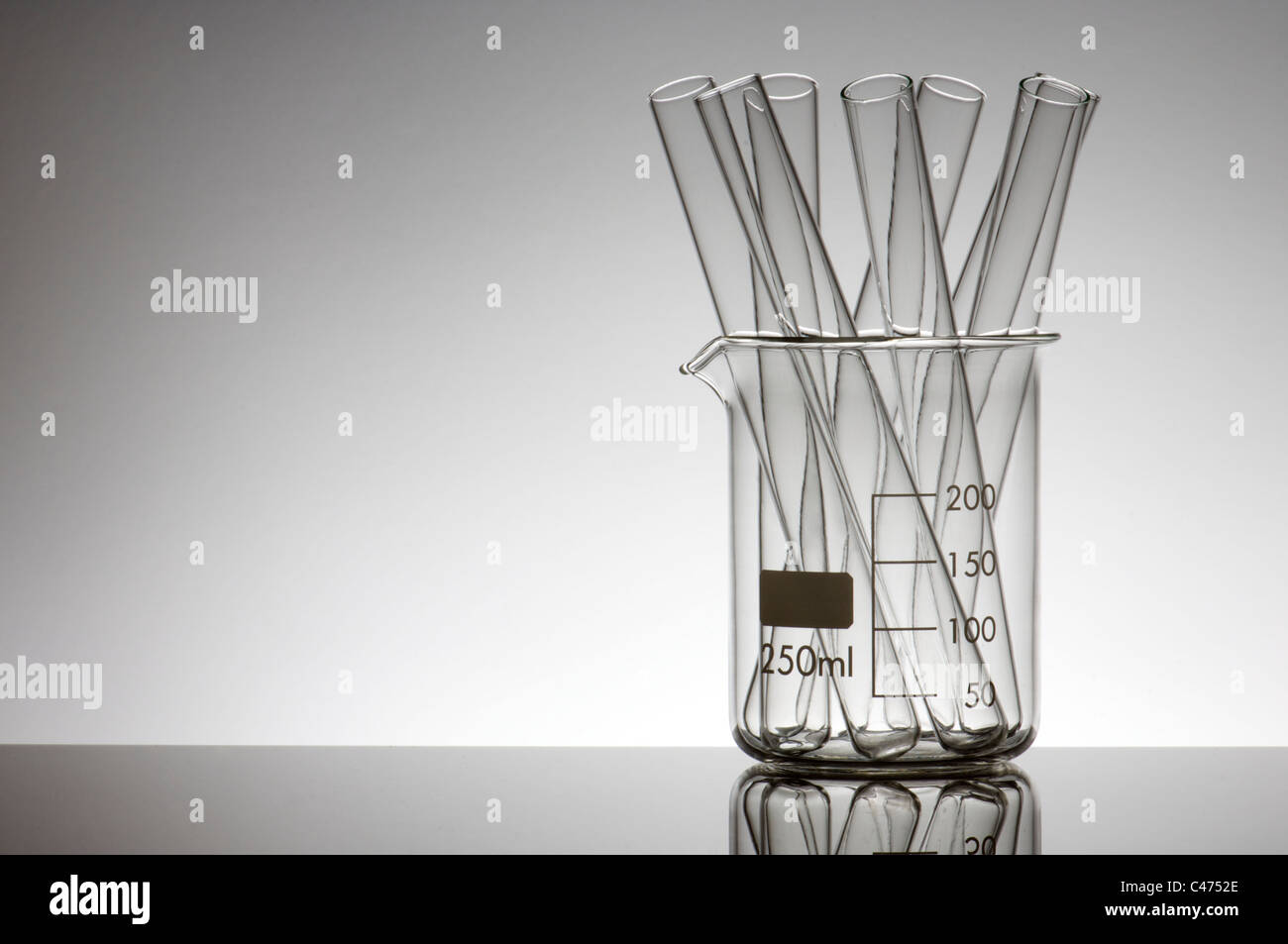 test tubes in a beaker with a white background Stock Photo - Alamy